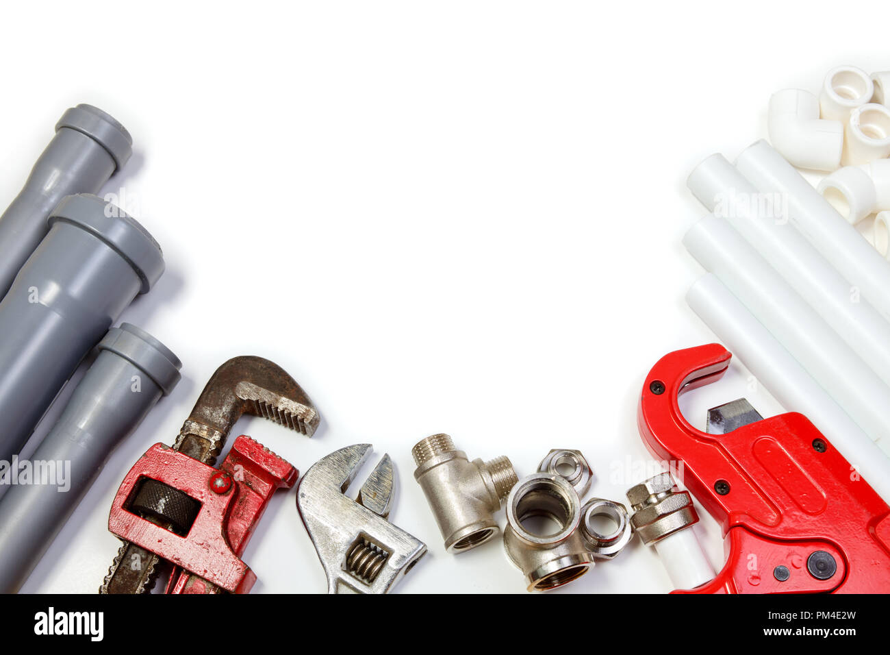 Plumbing tool pipes and fittings on white background Stock Photo - Alamy