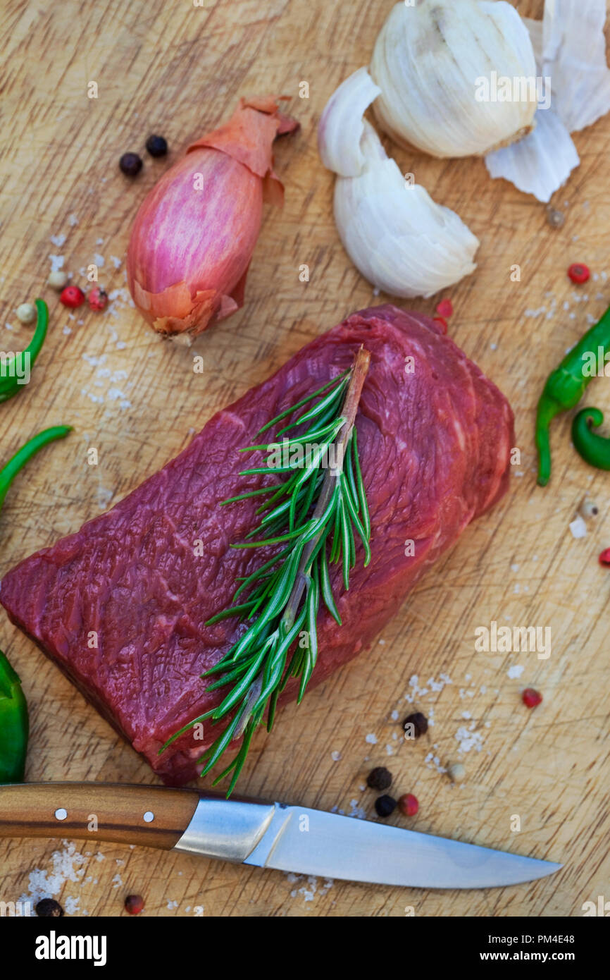 Beef herbs and garlic in a kitchen before cooking Stock Photo - Alamy