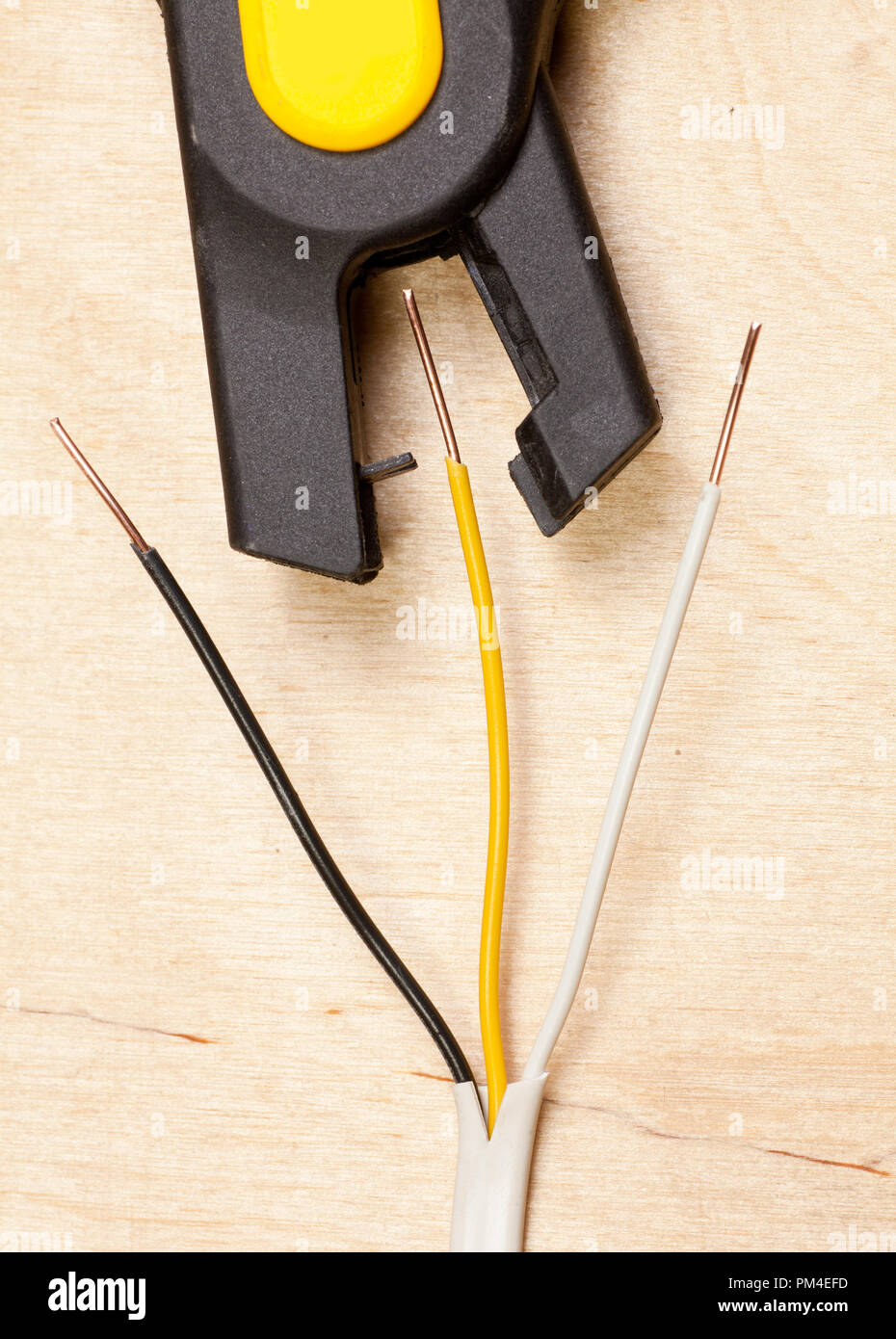 An automatic wire stripper with stripped copper wires Stock Photo - Alamy