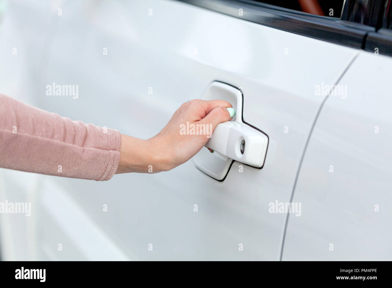 Girl opening car door hi-res stock photography and images - Alamy