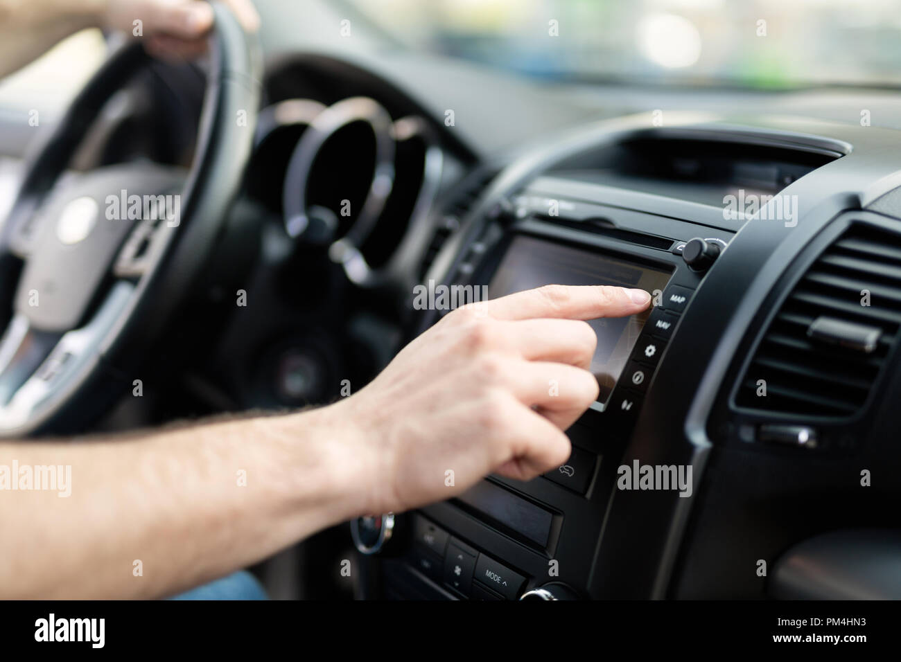 Man using navigation system while driving car Stock Photo - Alamy Man using navigation system while driving car Stock Photo - Alamy