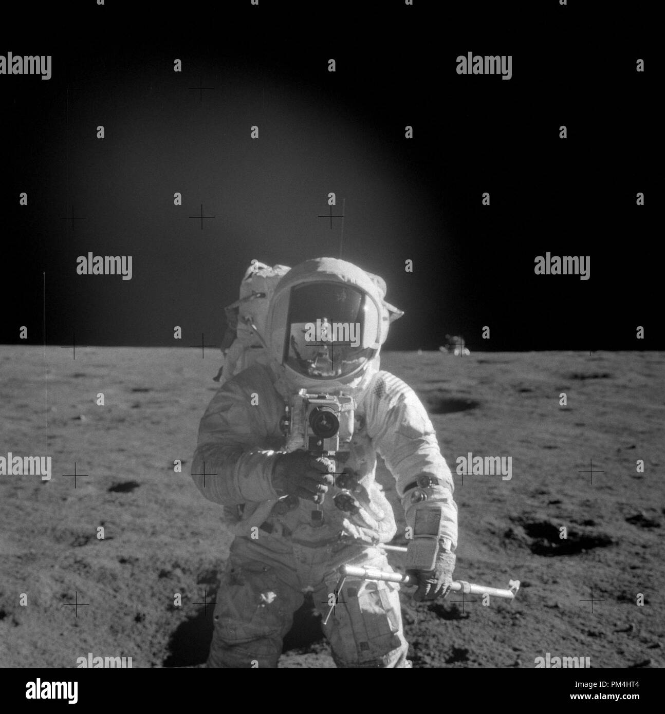 Astronaut Charles Conrad Jr., Apollo 12 commander, using a 70mm ...