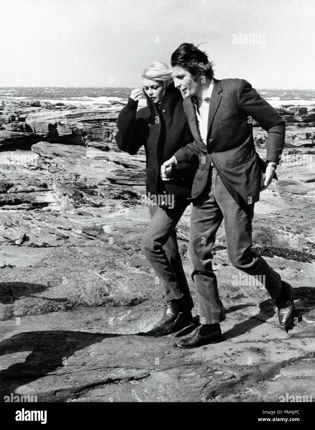 A windswept Brigitte Bardot arriving on the beach with husband Gunther ...