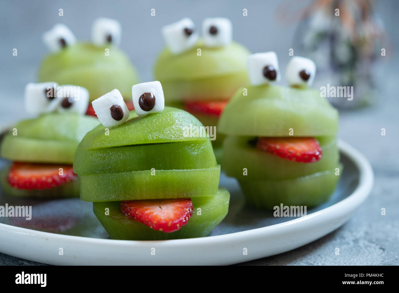 Spooky green kiwi monsters for Halloween party Stock Photo - Alamy