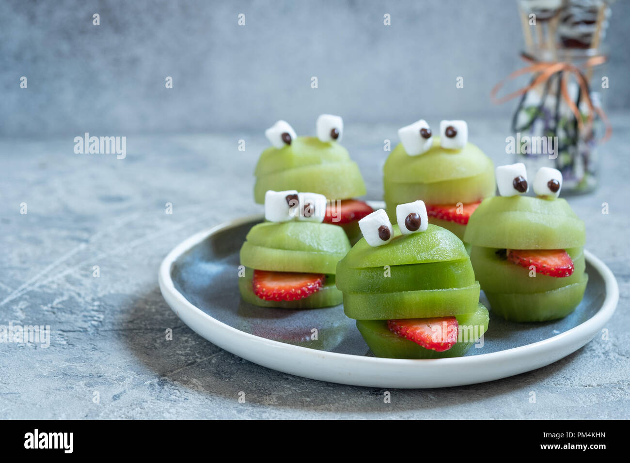 Spooky green kiwi monsters for Halloween party Stock Photo - Alamy