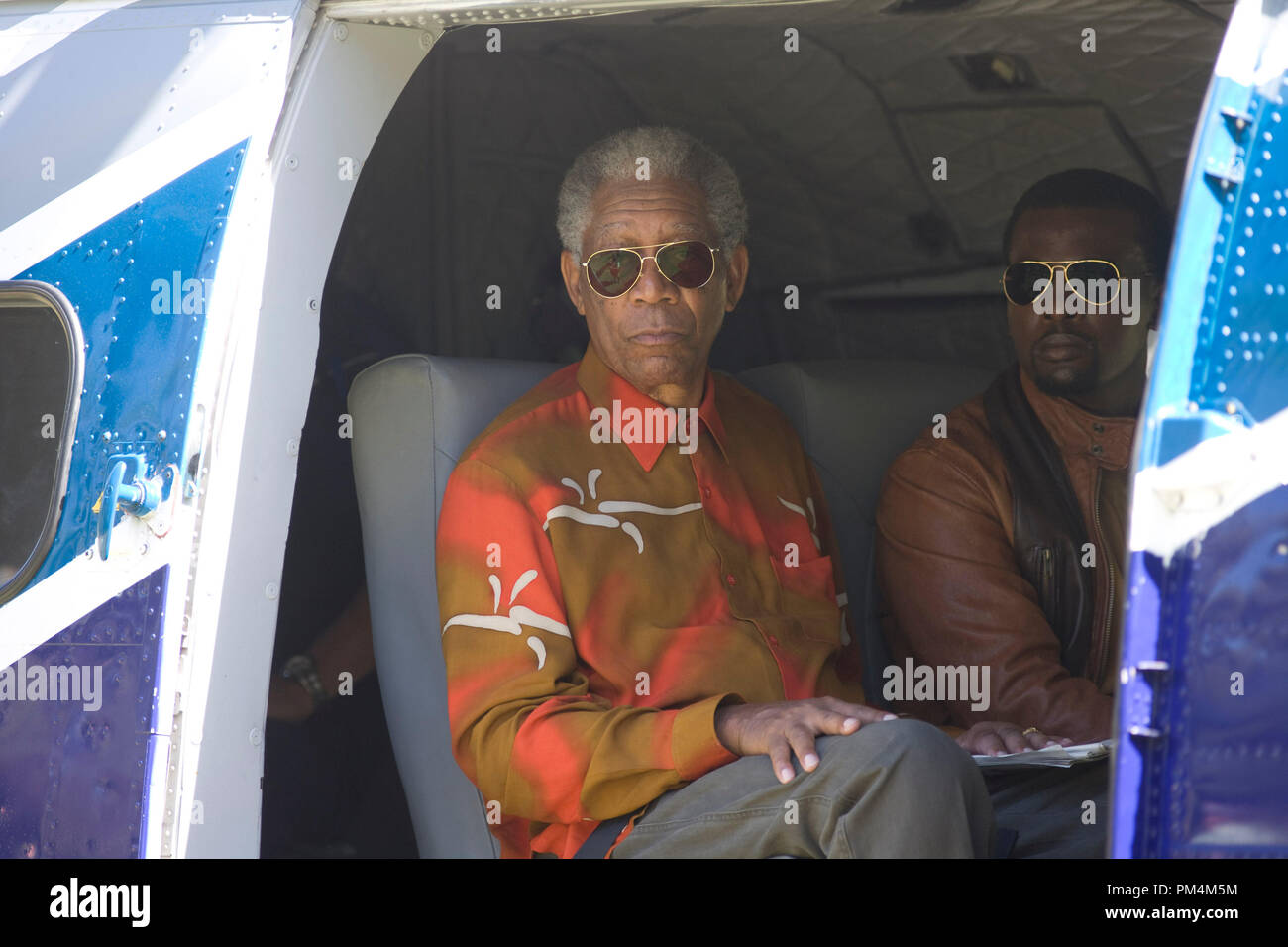 (L-r) MORGAN FREEMAN as Nelson Mandela and TONY KGOROGE as his security ...