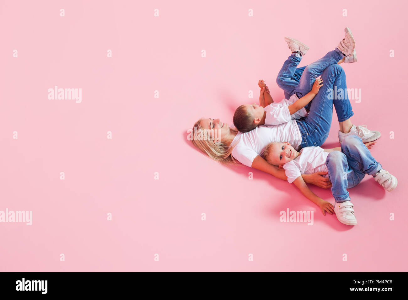 happy mom with two happy sons. Young woman and two baby boys, Happy ...