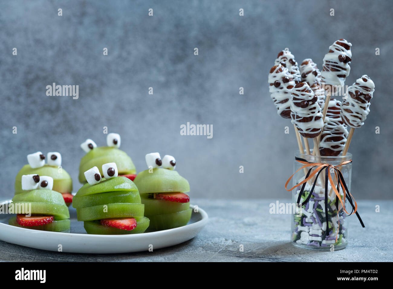 Spooky green kiwi monsters for Halloween party Stock Photo - Alamy