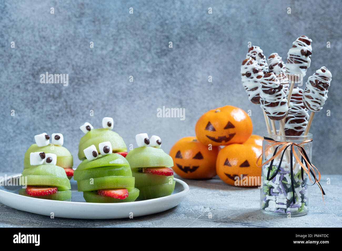 Spooky green kiwi monsters for Halloween party Stock Photo - Alamy