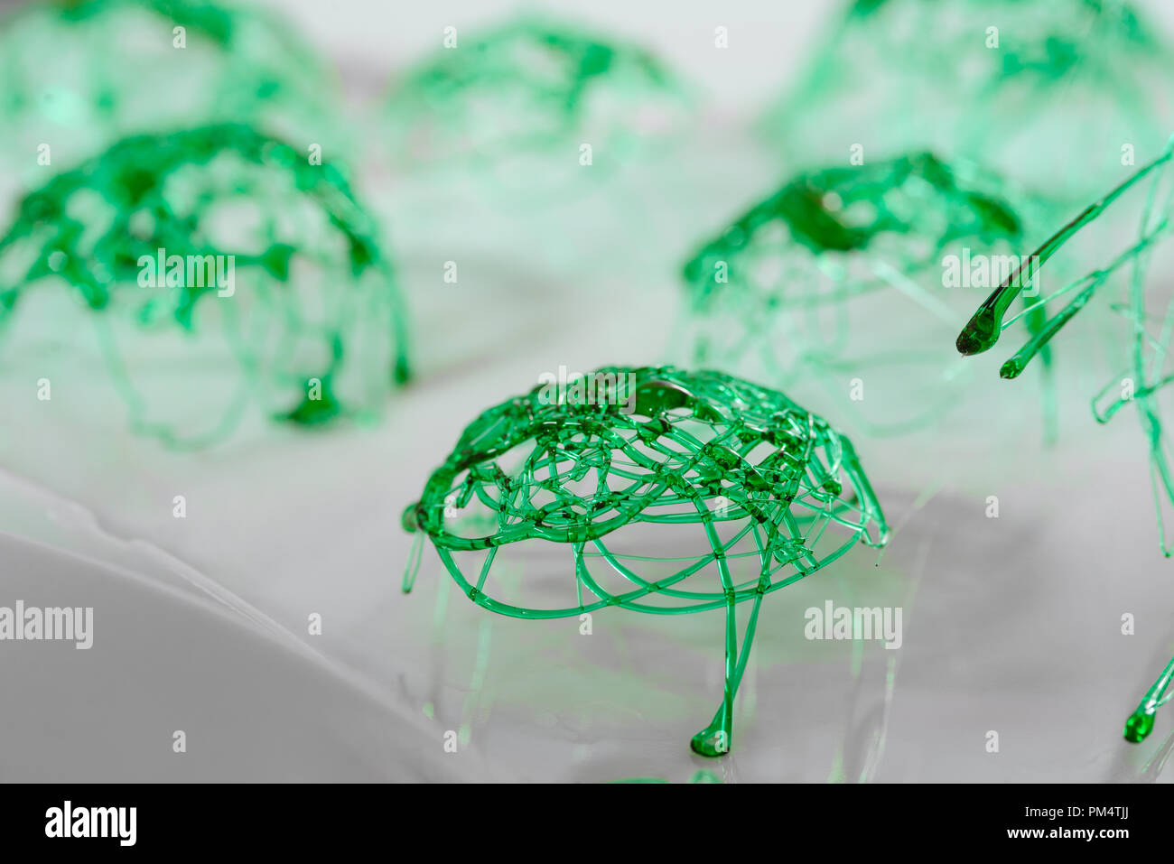 Green caramel cages Stock Photo - Alamy