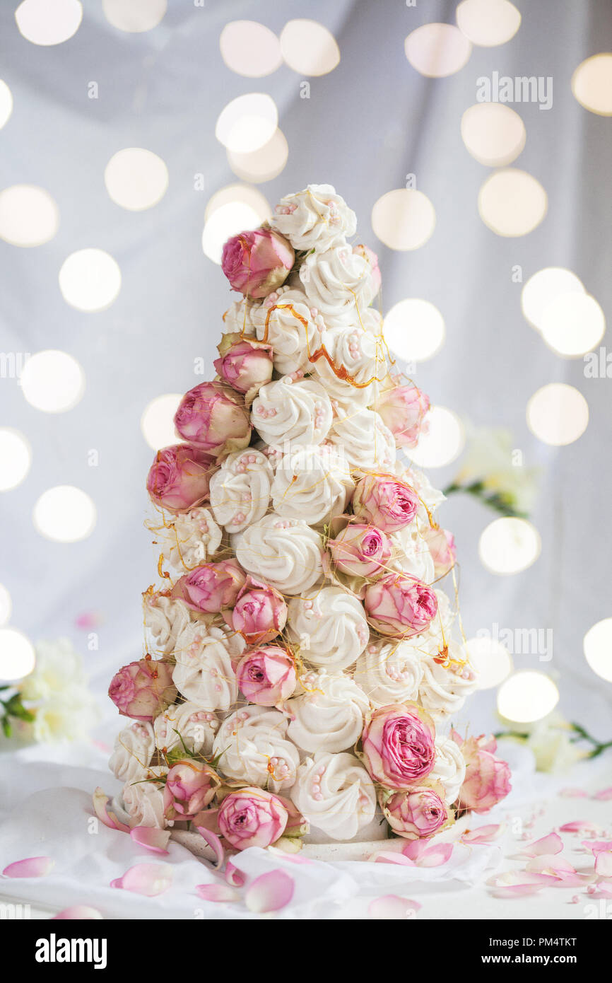 Zefir croquembouche with Rose flowers Stock Photo - Alamy