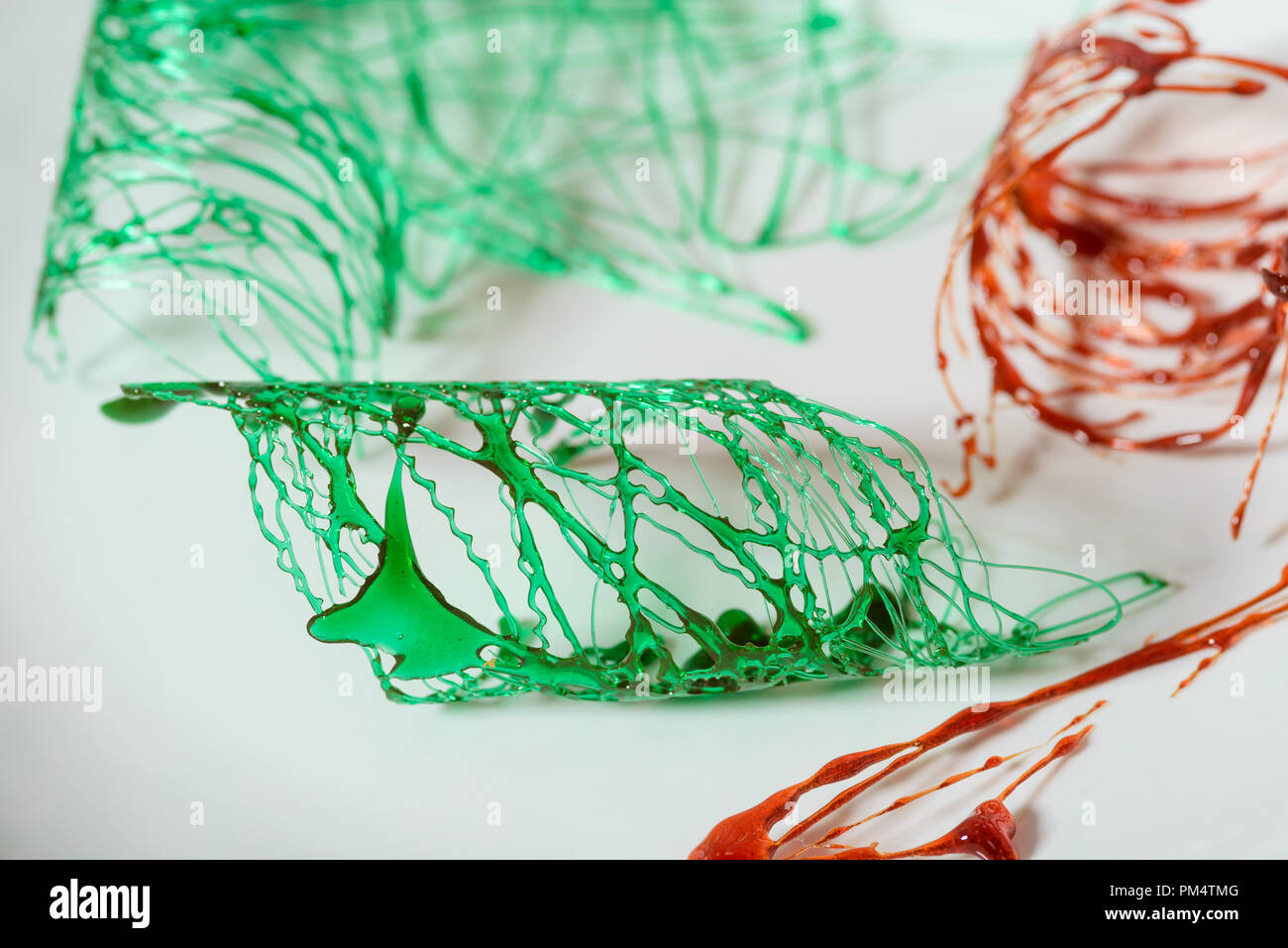 Red and green pastry garnishes Stock Photo - Alamy
