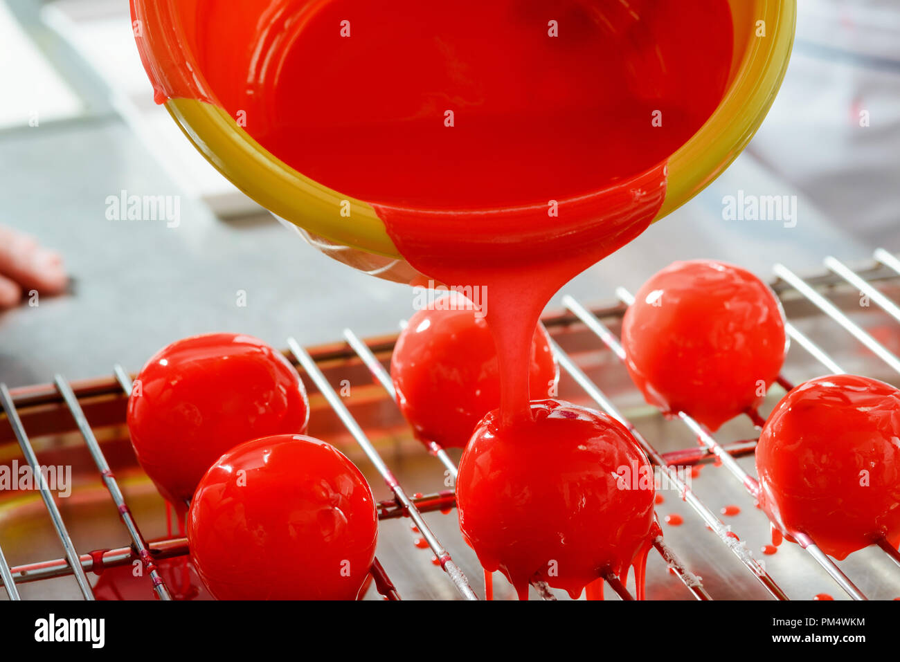 Red syrup for yummy sweets Stock Photo - Alamy