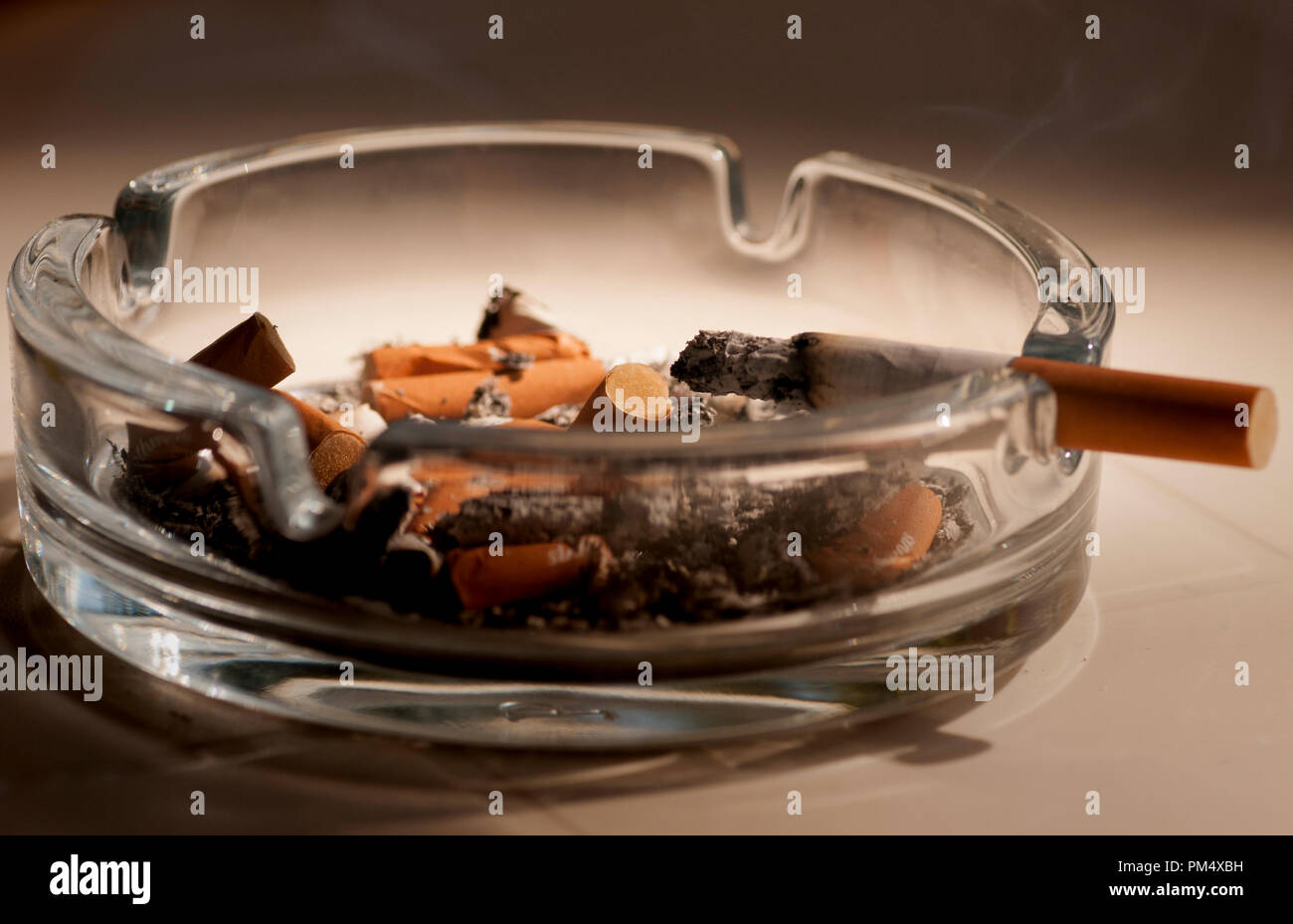 ashtray with cigarette Stock Photo - Alamy