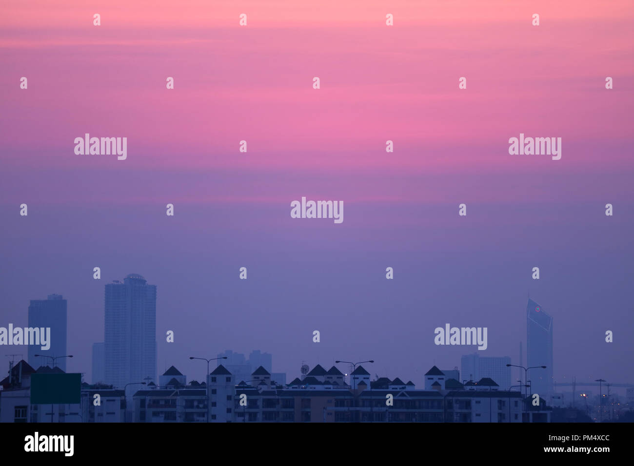 Beautiful purple blue sunset sky over the high buildings of Bangkok ...