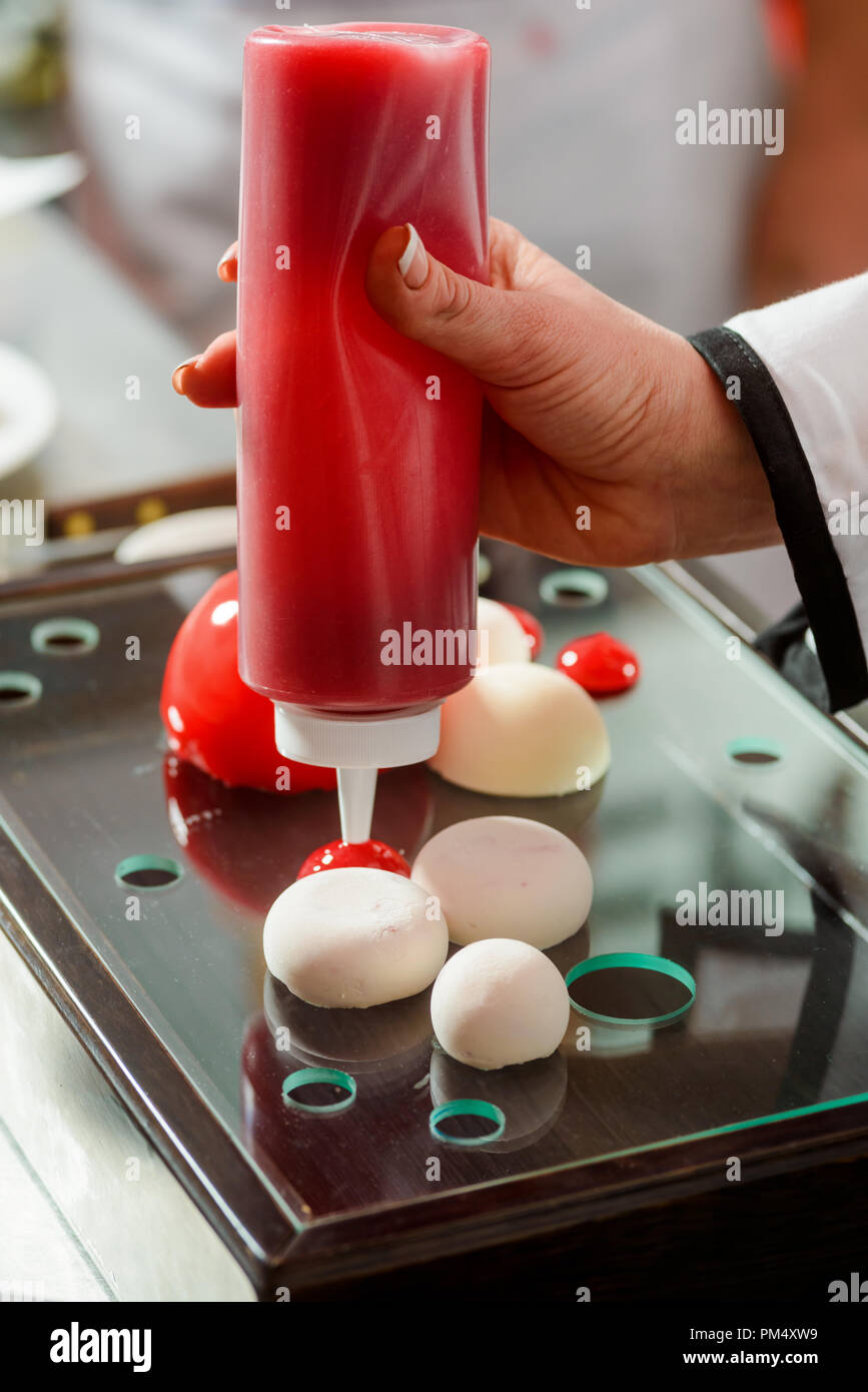 Strawberry sauce and yogurt spheres Stock Photo - Alamy