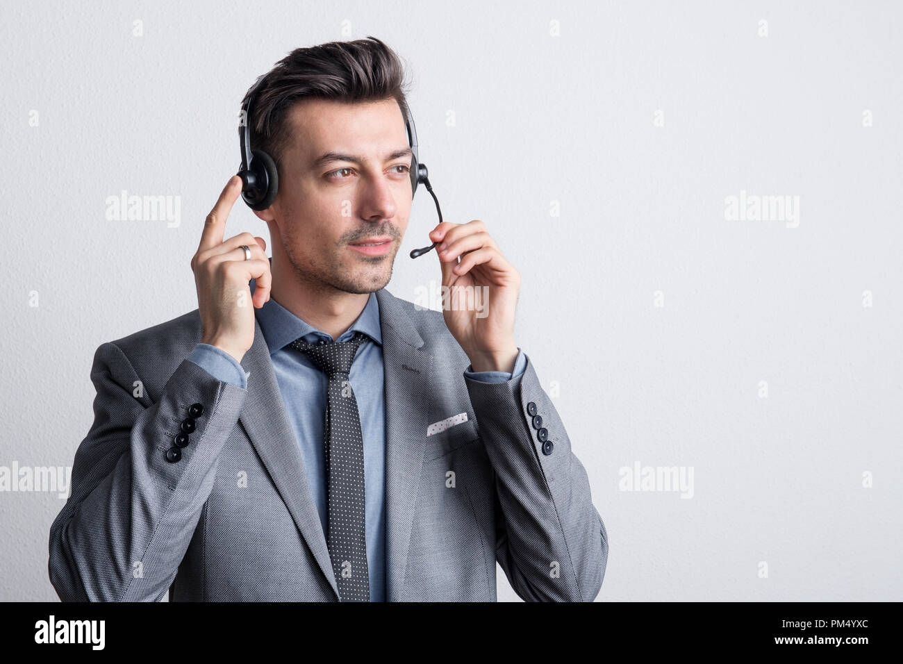 Headset microphone young man hi-res stock photography and images - Alamy