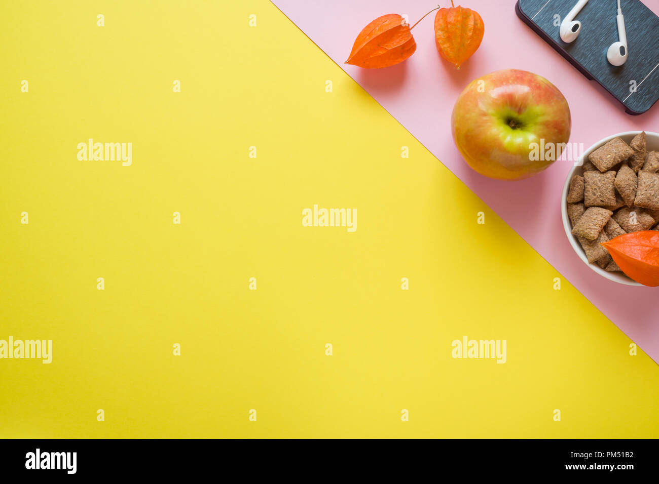 Stationery, Apple and cookies on the yellow table with copy space ...
