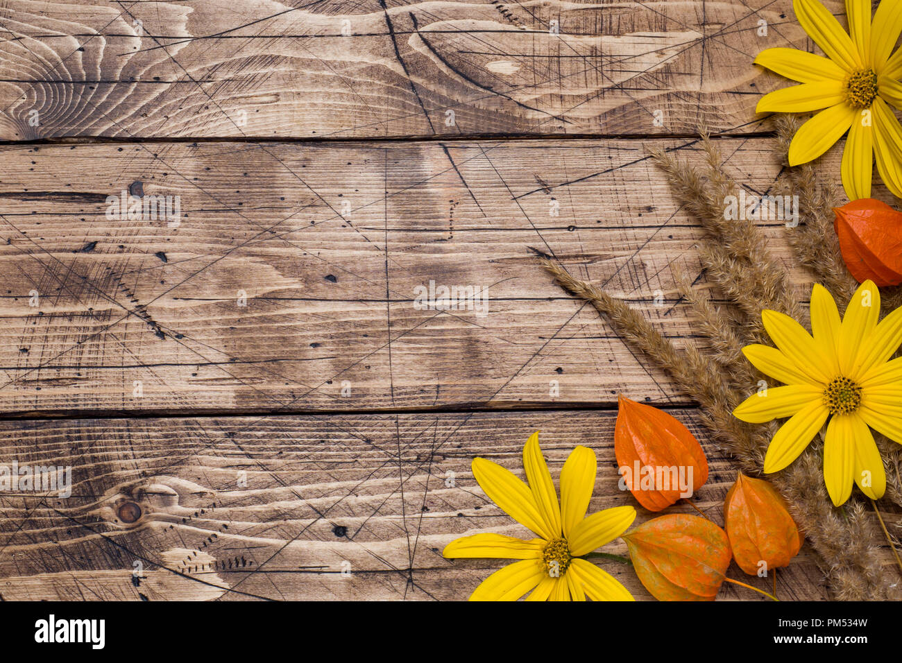 Autumn flowers on wooden background with copy space Stock Photo - Alamy