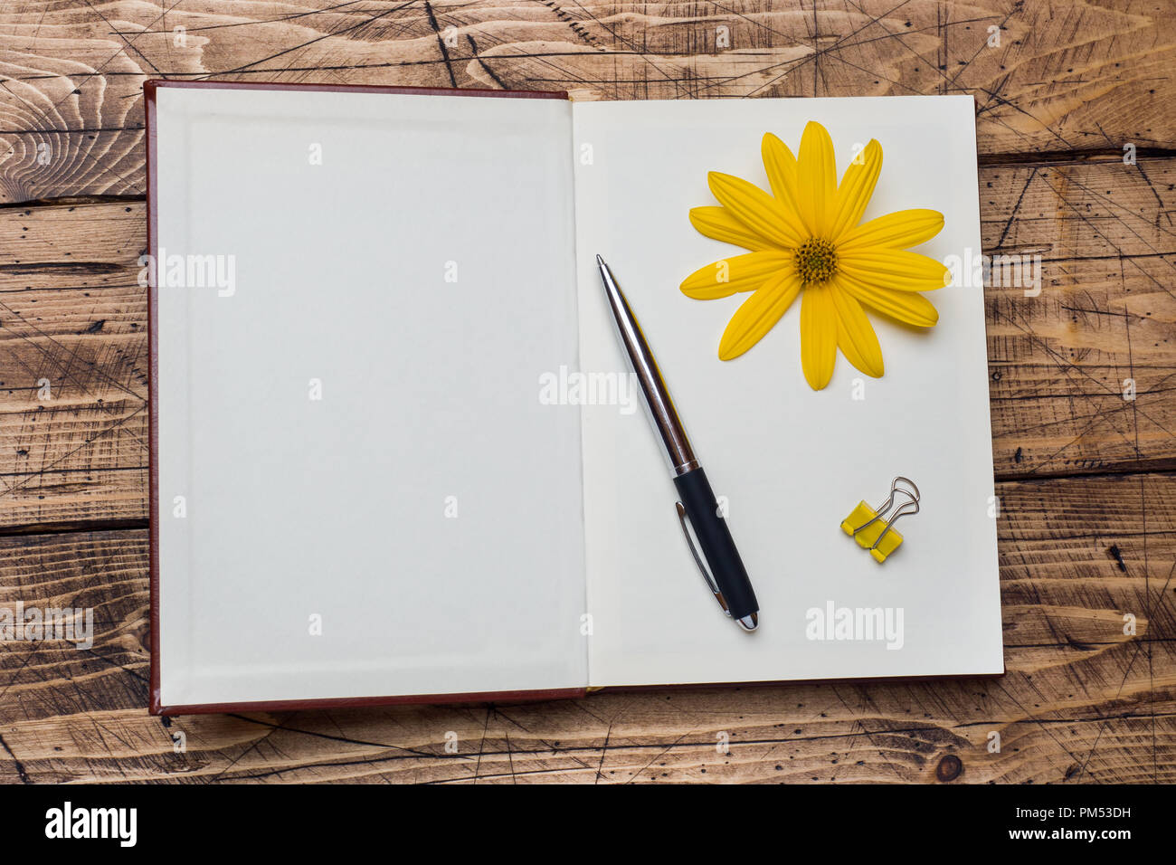 Autumn flowers and Notepad for text on wooden background with copy ...