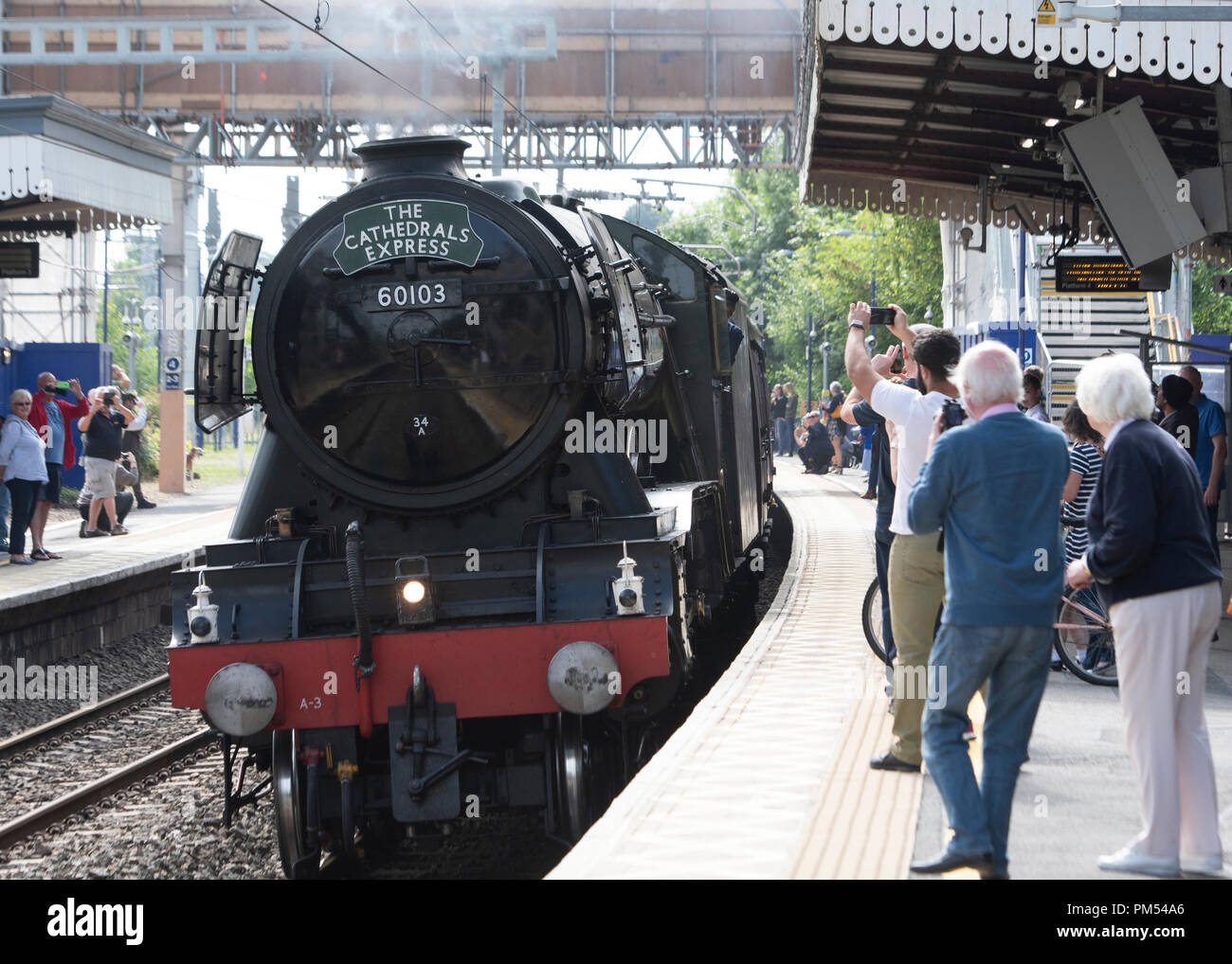 Flying Scotsman express steam train pulling vintage carriages on a ...