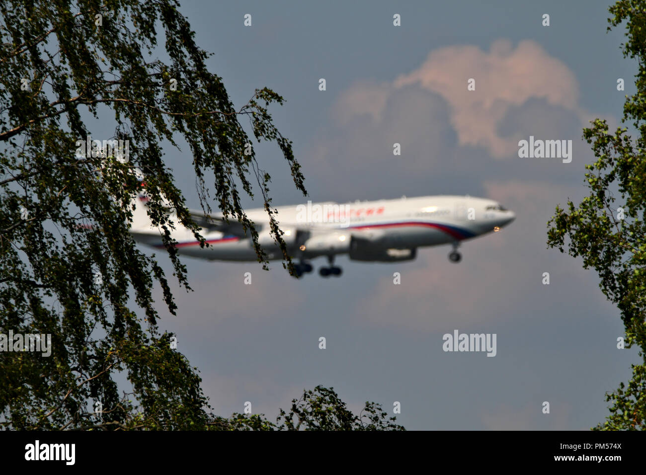White airplane with blue stripes hi-res stock photography and images ...