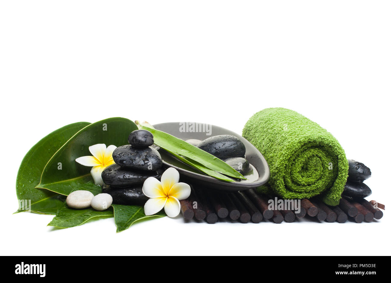 Tropical objects with black plate with stones on white background Stock ...