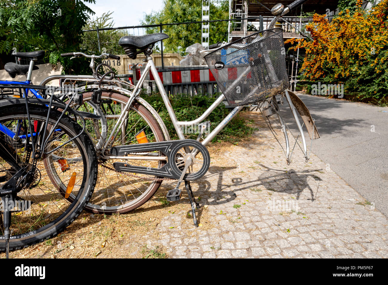 A bicycle with a wheel missing in Berlin Stock Photo - Alamy