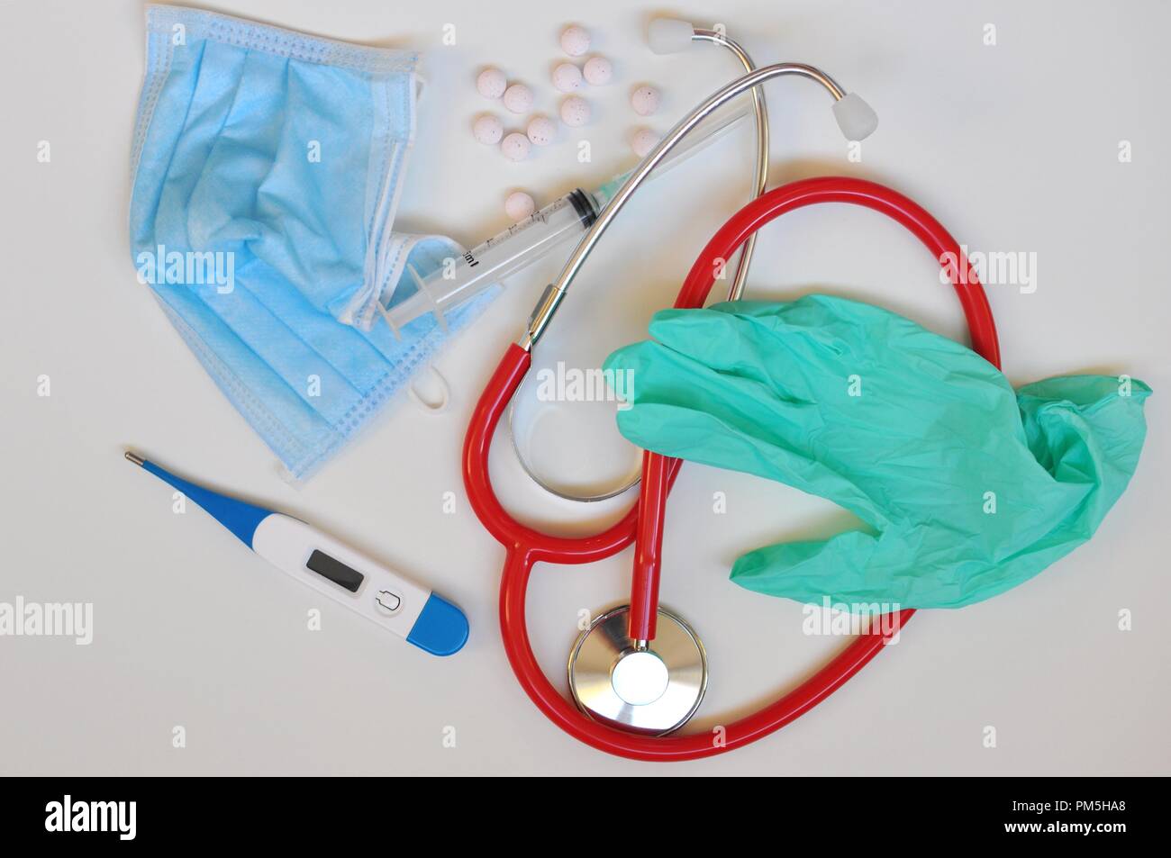 Medical concept equipment: medicine stethoscope and pills, syringe ...