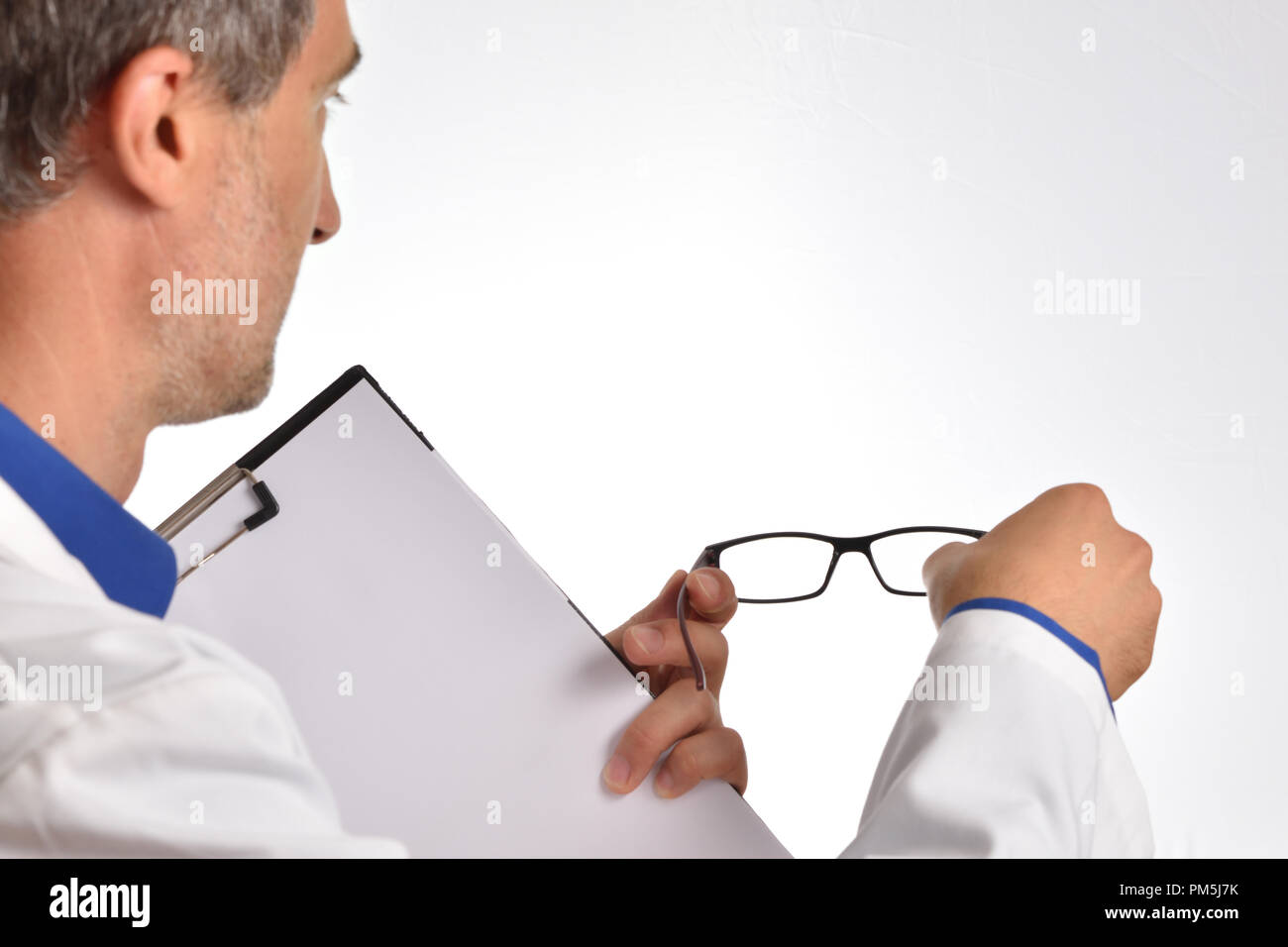 Optometrist back adjusting glasses of sight. Concept of visual ...