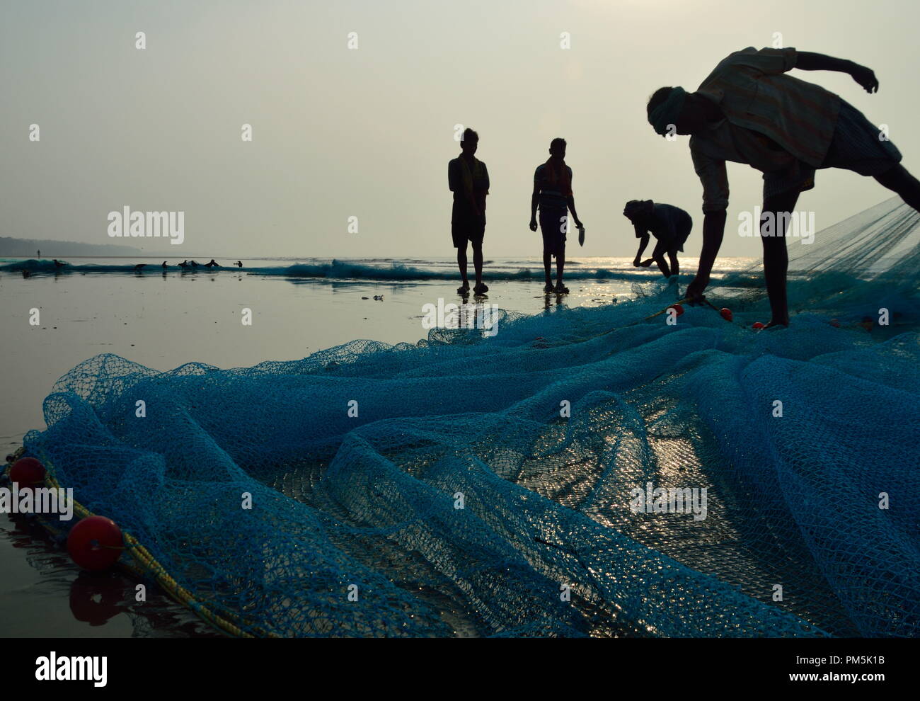 Daily life of the fishermen, they use fishing net to catch fishes ...