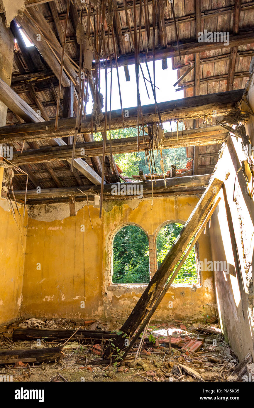 the abandoned interior of an old house with a broken roof Stock Photo ...