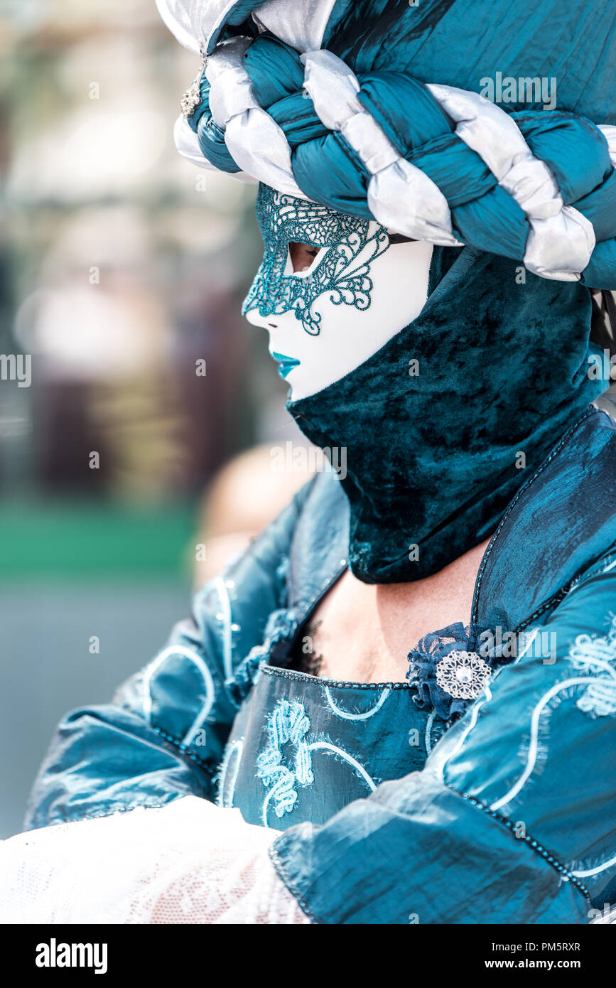 a masked woman in a traditional Venetian carnival costume Stock Photo ...