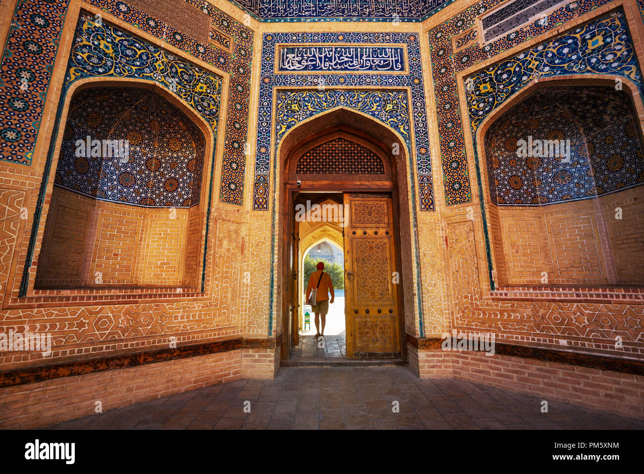 Tourist near ancient historic building in Uzbekistan Stock Photo - Alamy