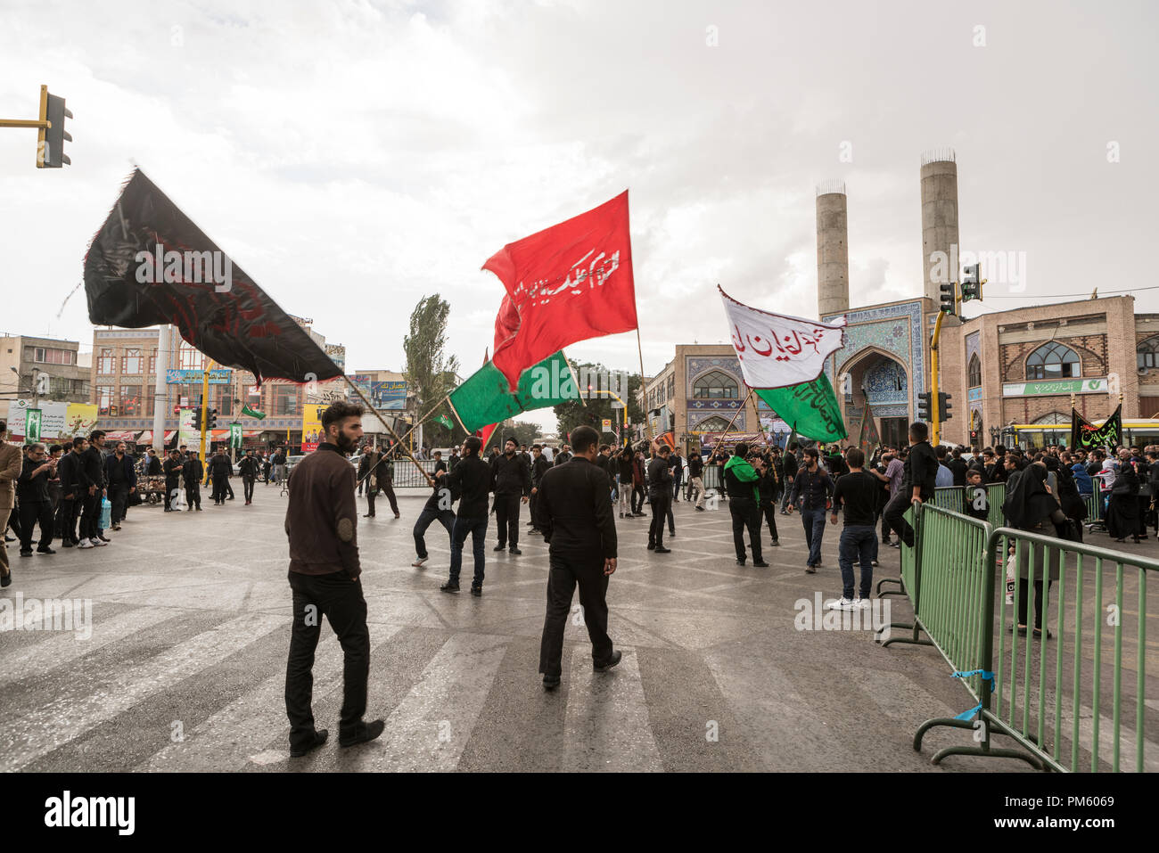Young men waving flags during a public procession in the lead up to ...