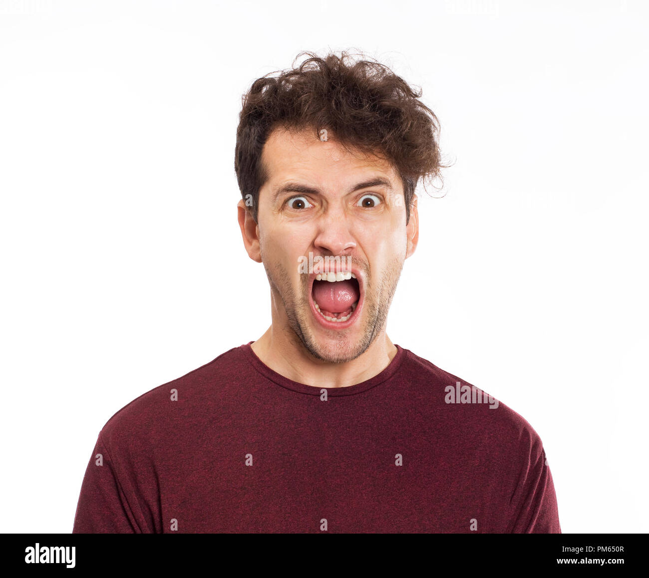 Portrait of an angry young man Stock Photo - Alamy