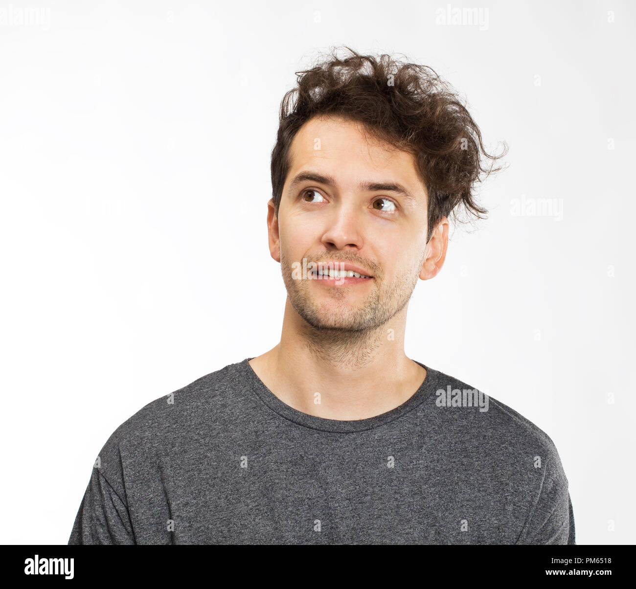 Smiling positive male with attractive look, wearing T-shirt Stock Photo ...