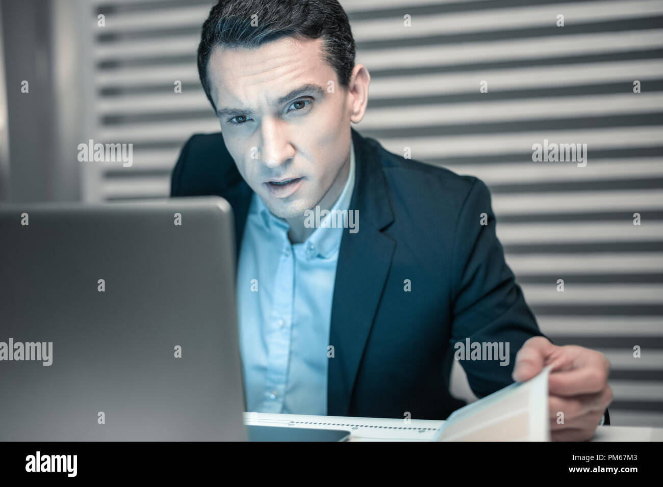 Handsome man creating design of the house Stock Photo - Alamy