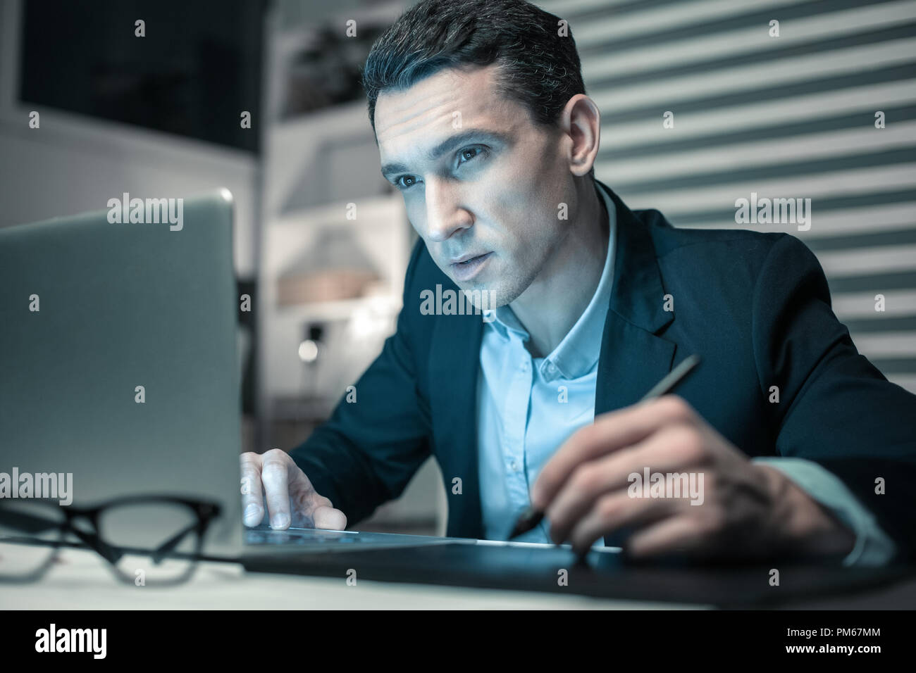 Businessman reading blueprints hi-res stock photography and images - Alamy