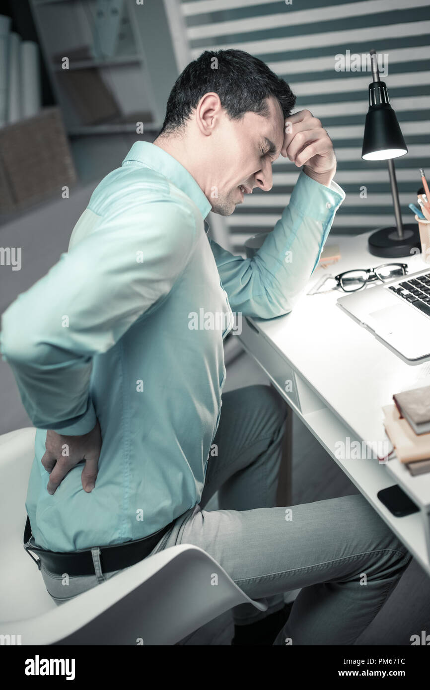 Business man sitting at the office table Stock Photo - Alamy
