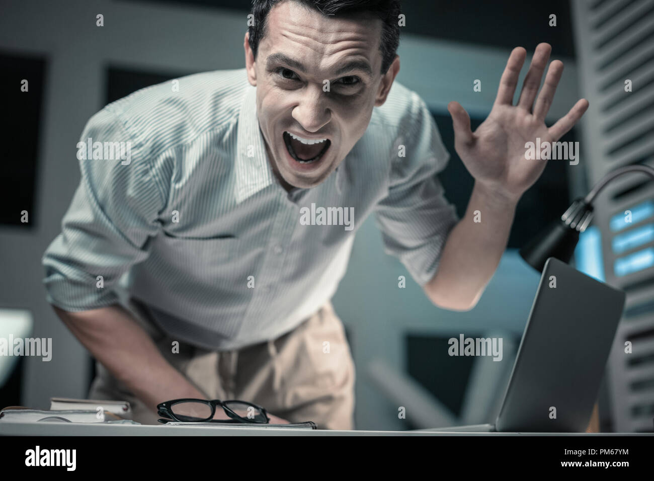 Furious head of department arguing with somebody Stock Photo - Alamy