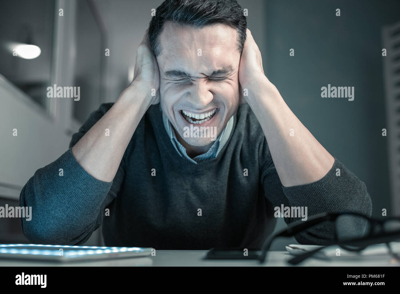 Squeezing head hi-res stock photography and images - Alamy
