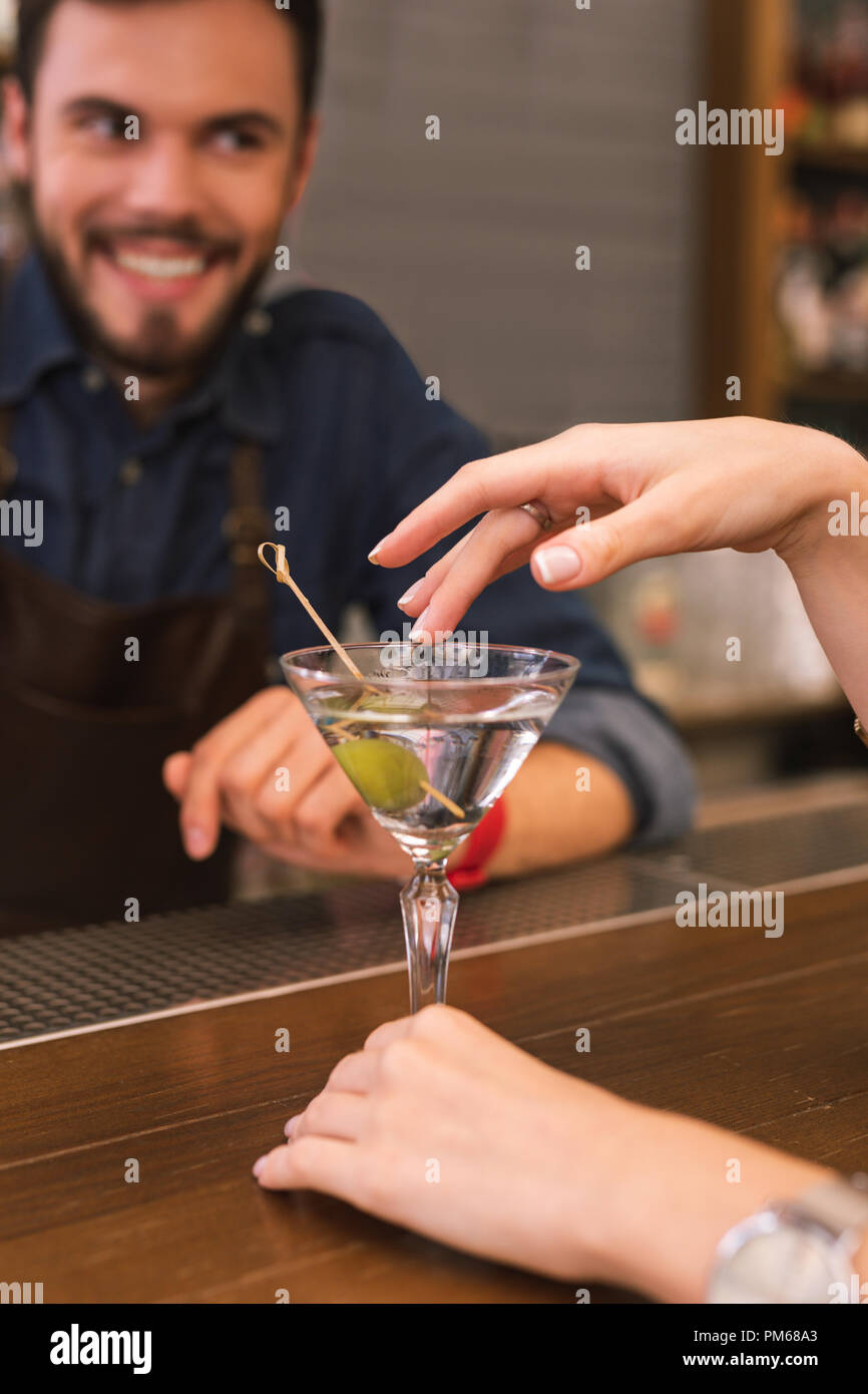 Young barman smiling client hi-res stock photography and images - Alamy