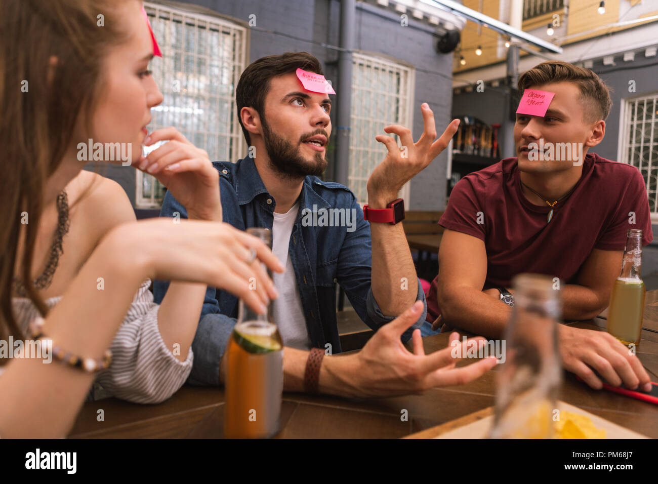 Thoughtful man using gestures and guessing the word in the game Stock ...
