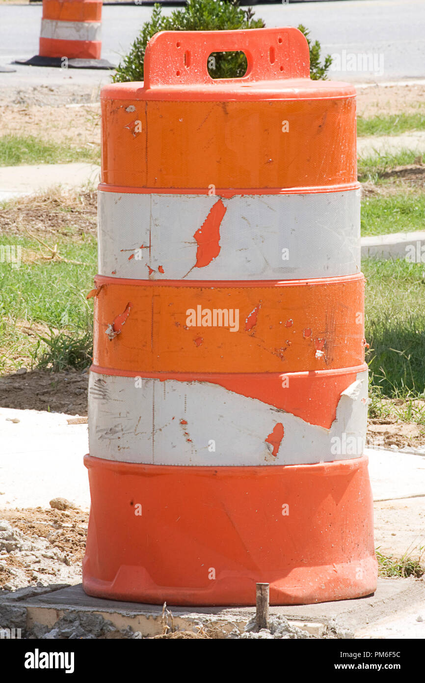 Orange and White Container markers directing traffic away from areas ...