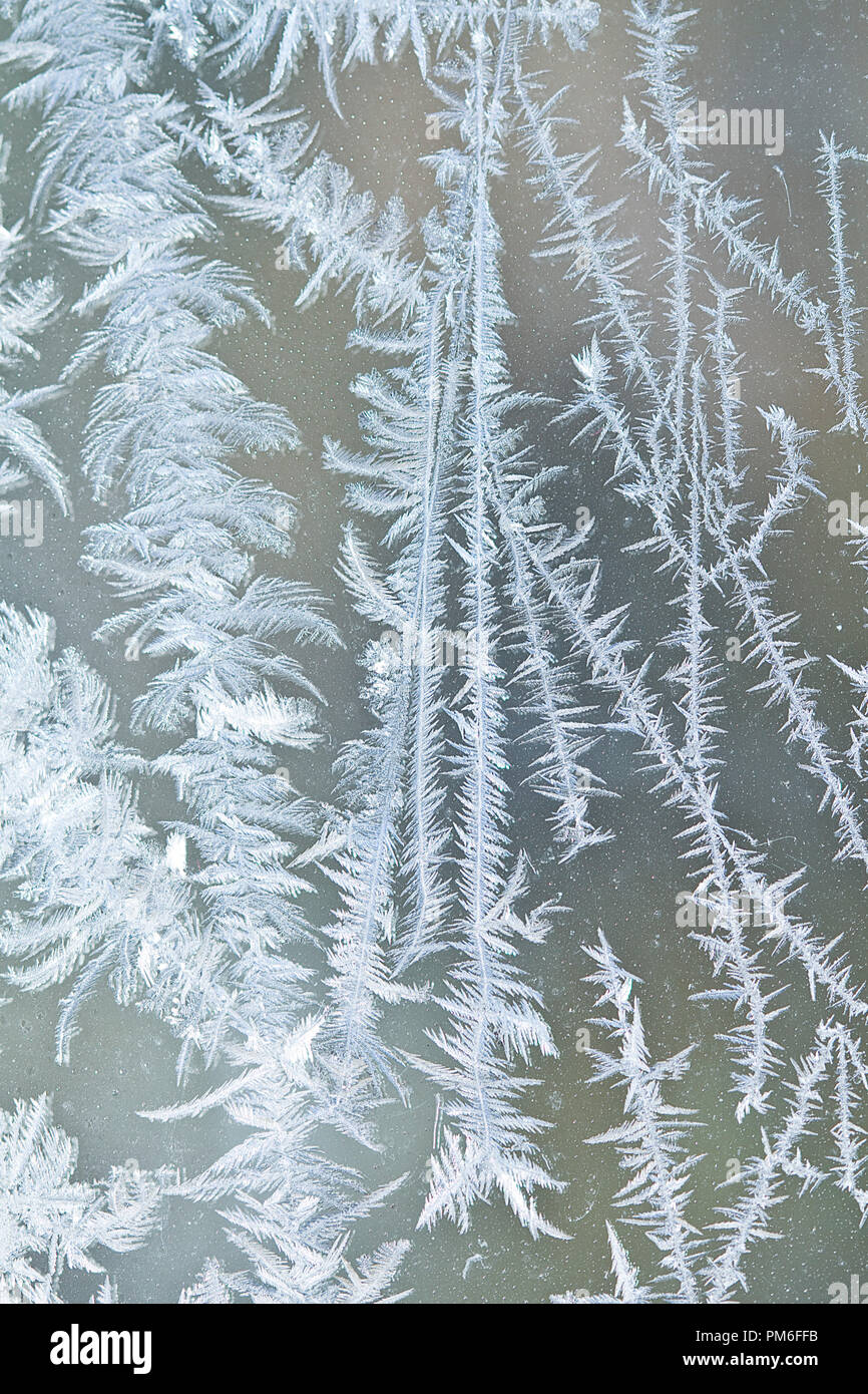 Beautiful ice formations on panes of glass in window Stock Photo - Alamy