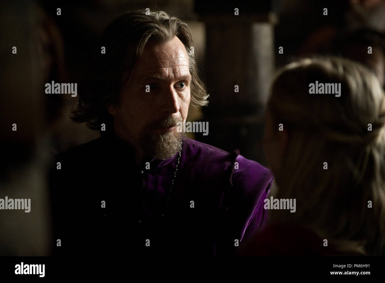 GARY OLDMAN as Father Solomon in Warner Bros. Pictures' fantasy ...