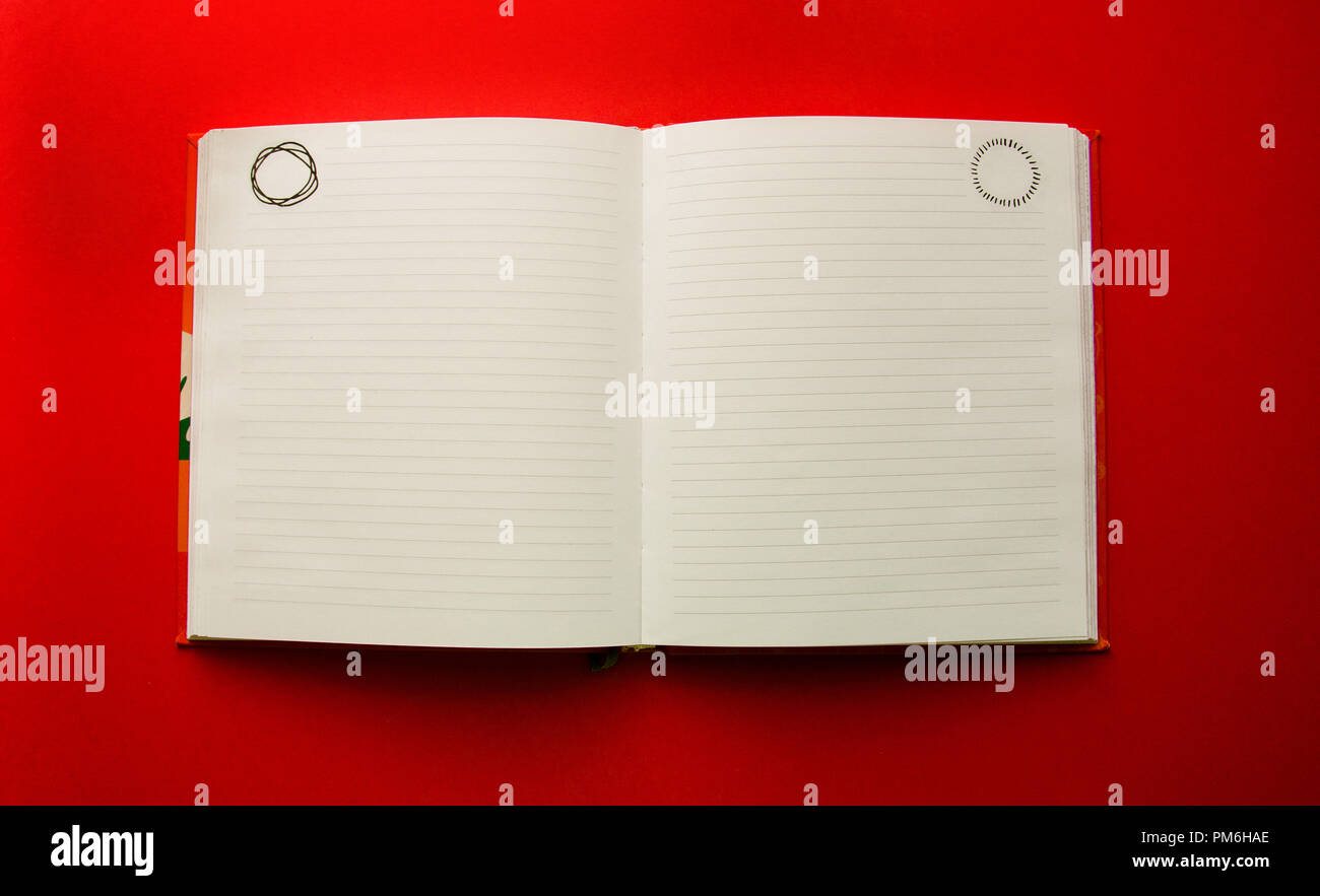 open blank notepad on red background with copy space Stock Photo - Alamy