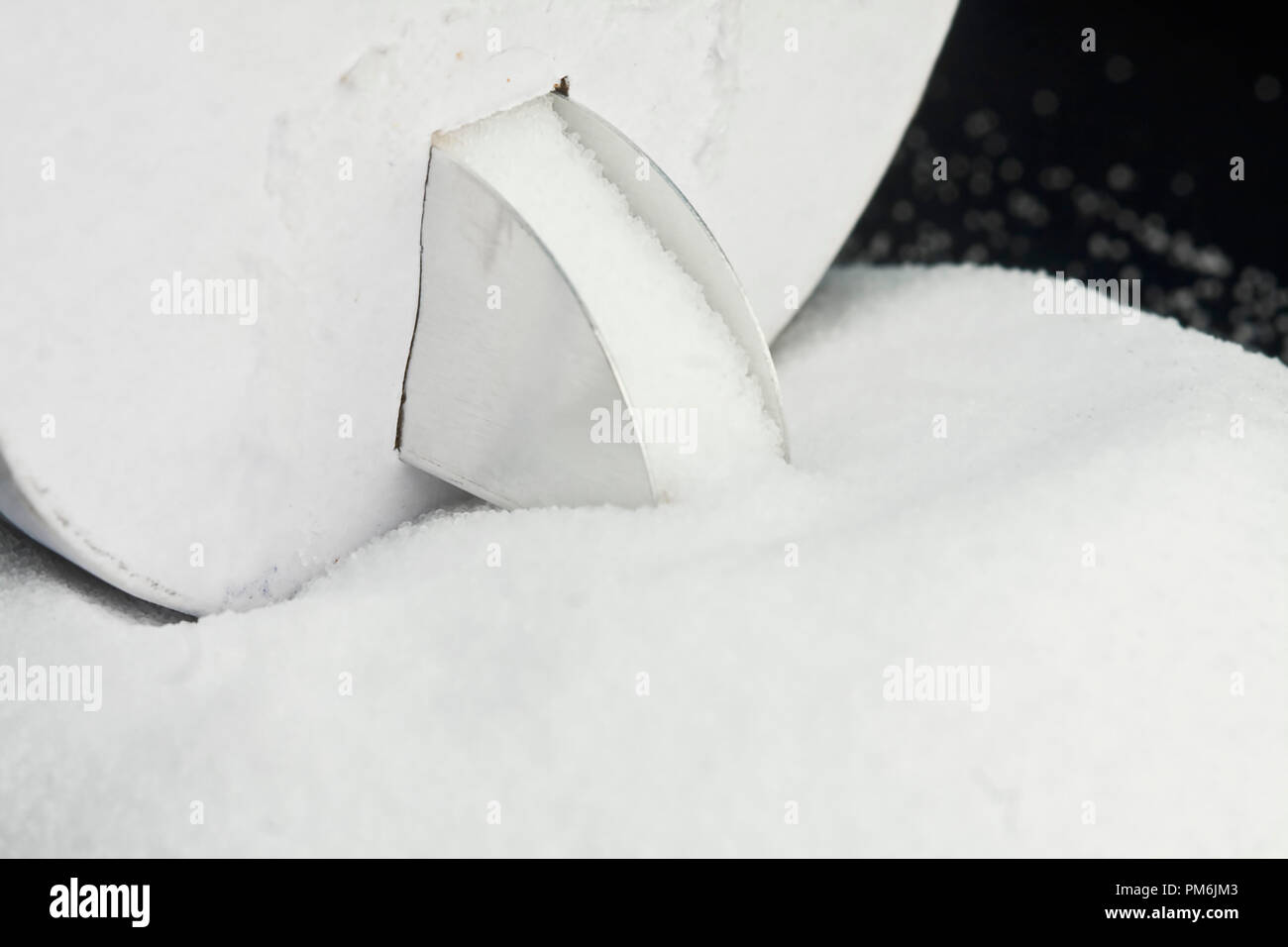 Container of Salt and pile of salt isolated on black background Stock ...