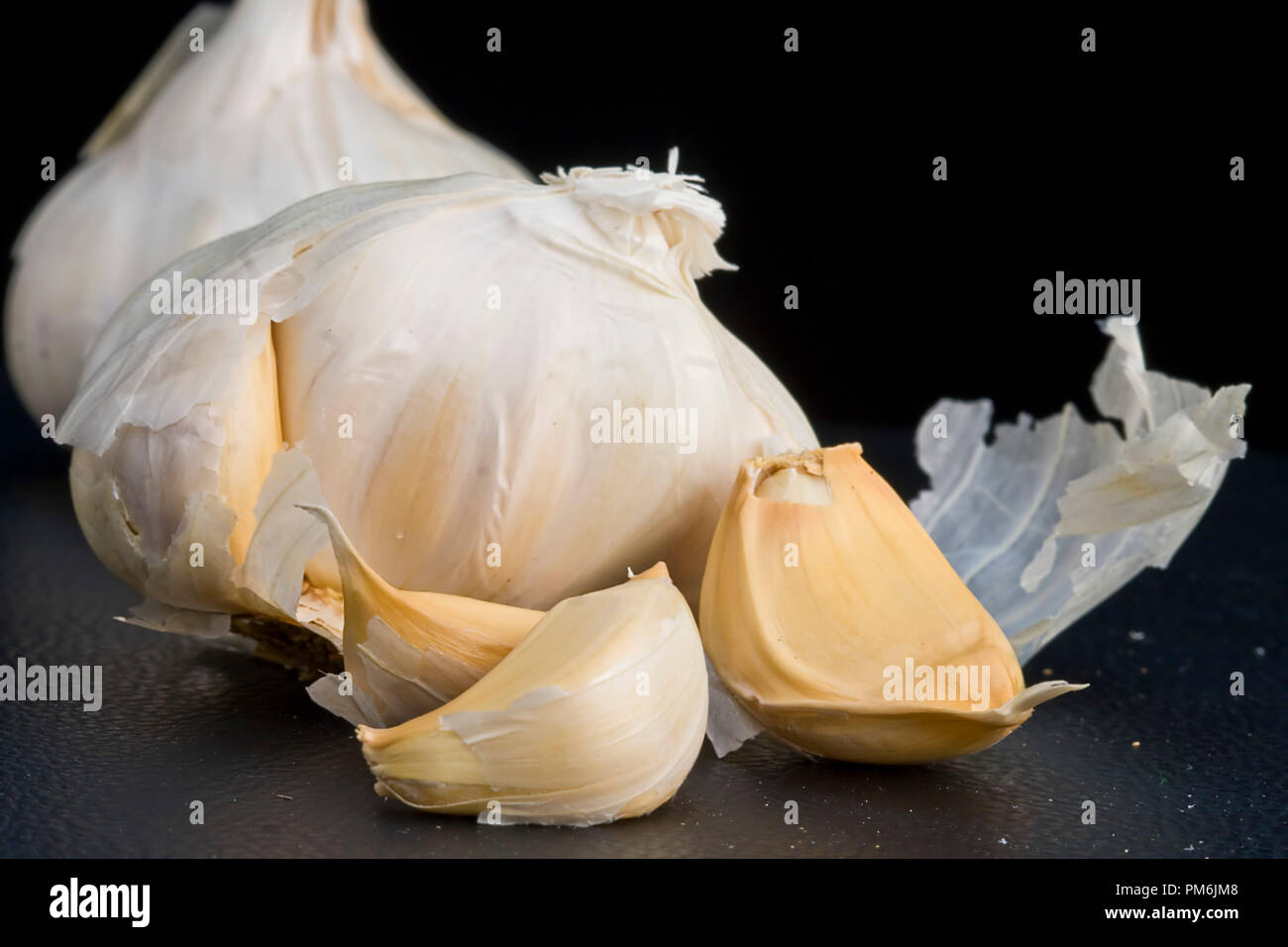 Close-up images of garlic cloves isolated on black background Stock ...